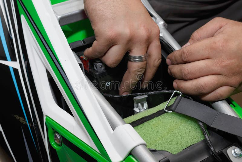 The Wizard Installs a New Battery on the Motorcycle after Refueling and ...