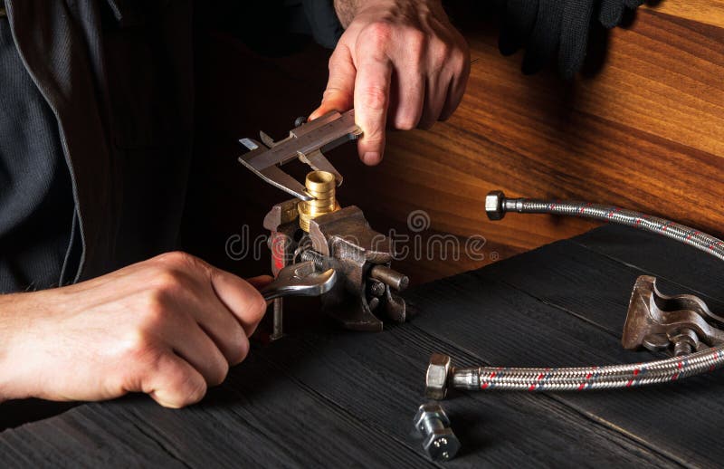 The Wizard Measures the Size of Fitting Using a Caliper before ...