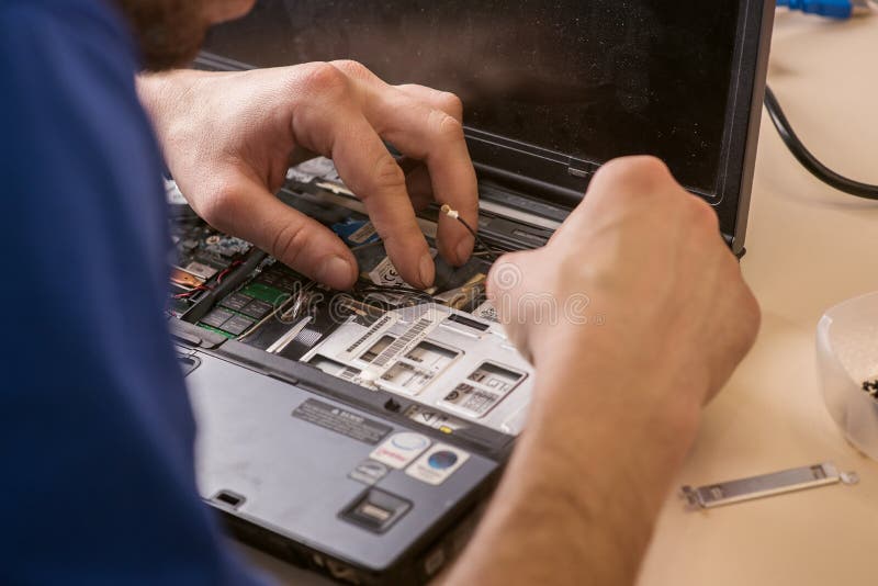 Wizard Repairs Laptop with Tools and Hands Stock Photo - Image of ...