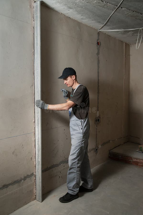 Woker Fixes a Guide To Align the Walls with Stucco Stock Image - Image ...