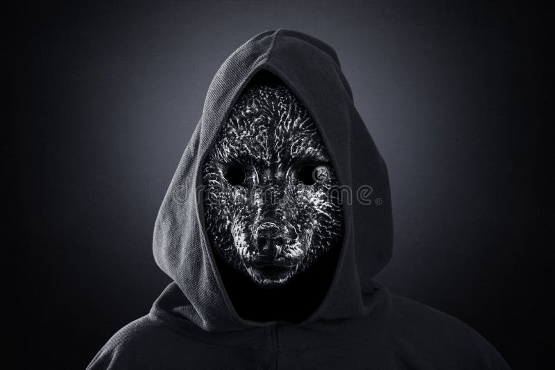 Wolf in Hooded Cloak at Night Over Dark Misty Background Stock Photo ...