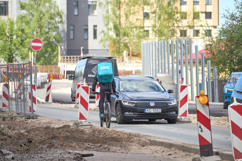 Wolt Food Delivery Man on a Bicycle on a Road Undergoing Reconstruction ...