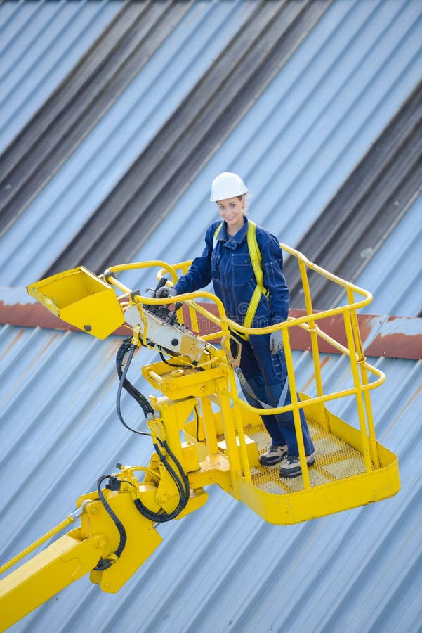 Woman Above Rooftops in Cherry Picker Bucket Stock Image - Image of ...