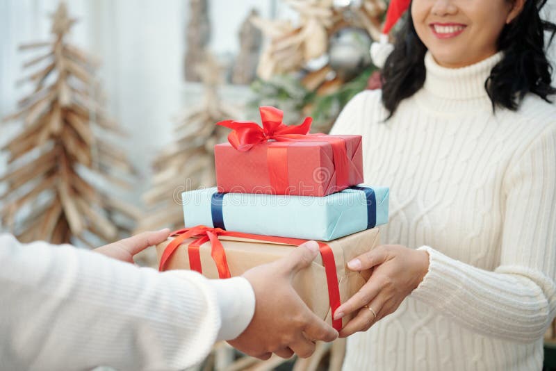Woman Accepting Christmas Presents Stock Image - Image of hands ...