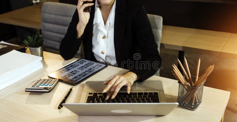 Woman Accountant Use Calculator and Computer with Holding Pen on Stock ...