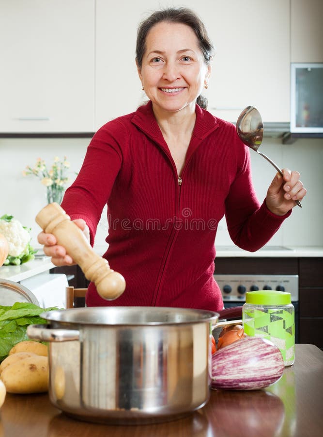 Woman Adding Seasoning into Soup Pan Stock Image - Image of kitchen ...