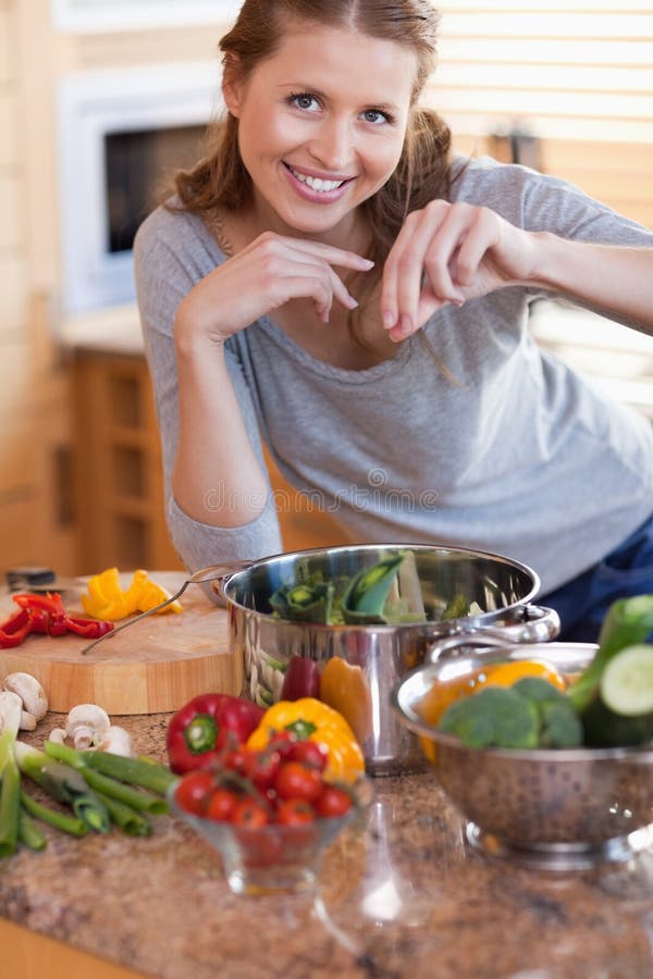 Woman Adding Some Spices To Her Meal Stock Image - Image of attractive ...