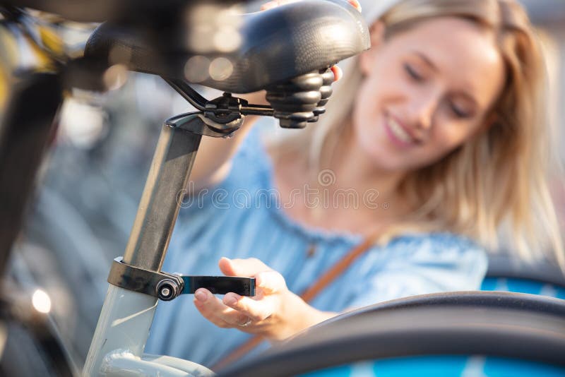 Woman Adjusting Height Bicycle Seat Stock Photo - Image of practice ...