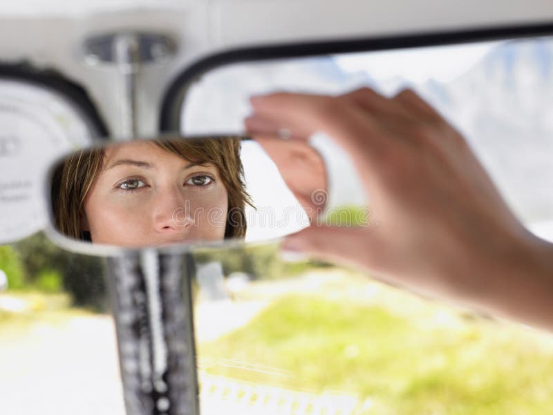 Woman Adjusting Rear View Mirror in Van Stock Image - Image of interior ...