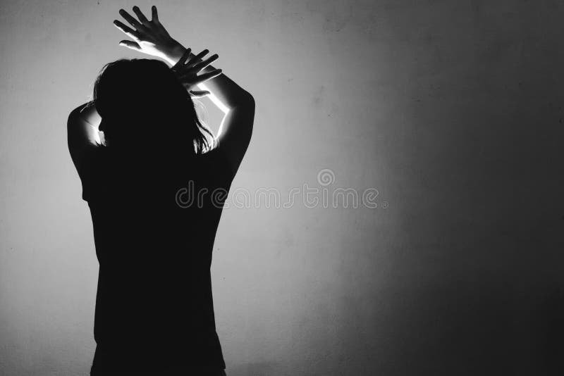 Woman Afraid of Something, Covering Face and Head with Light Behind ...