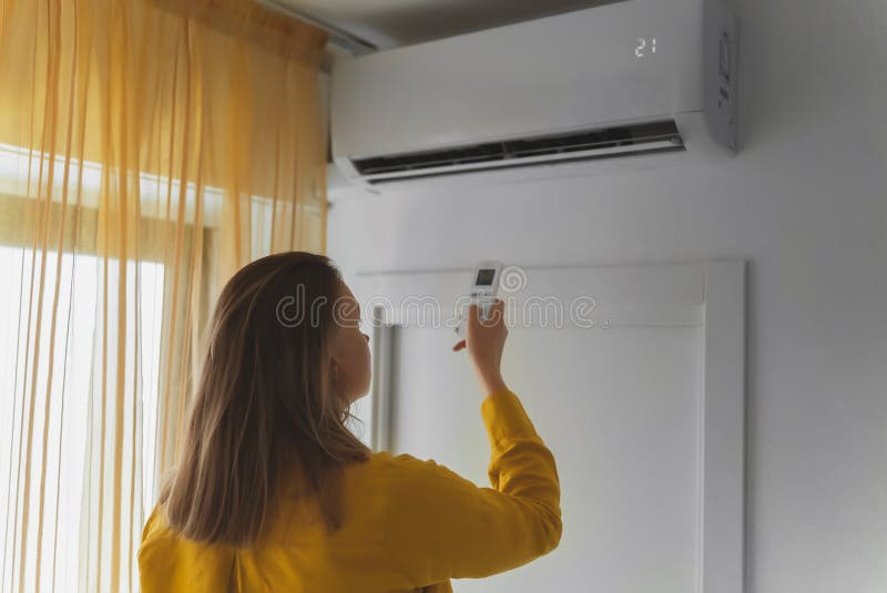 Woman with air conditioner stock image. Image of airconditioner - 250846071