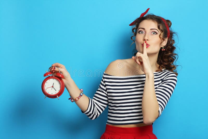 Woman with an alarm clock stock image. Image of clothes - 92231167