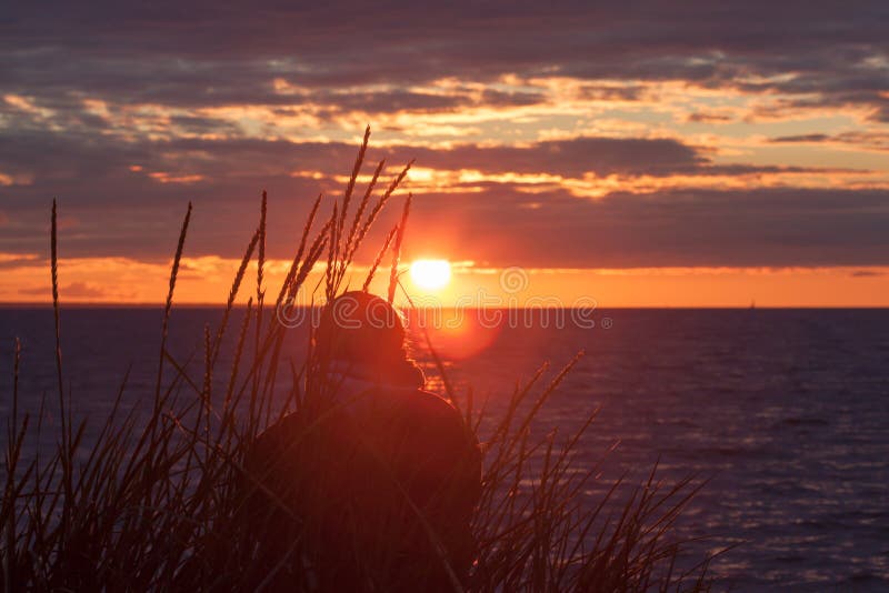 Woman Alone Watching the Sunset Stock Photo - Image of lone, sunset ...