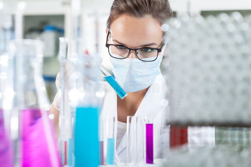 Woman Analyzing Liquid in Test Tube Stock Photo - Image of microbiology ...