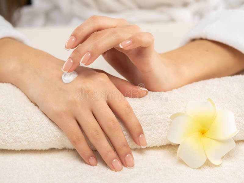 Woman Applies A Cosmetic Moisturizer On Her Hands Stock Image Image