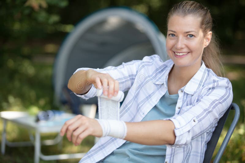 Woman Applying Arm Bandage on Arm Stock Image - Image of apply ...