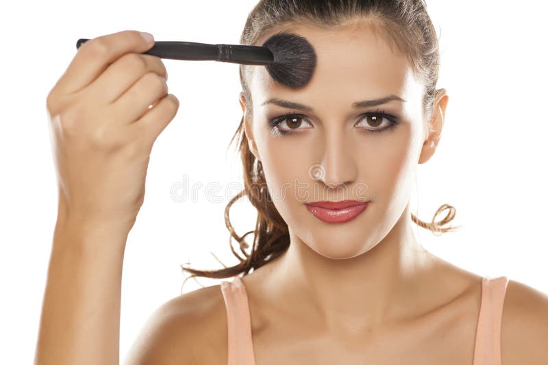 Woman applying blush stock photo. Image of beautiful - 86076834