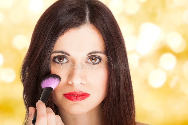 Woman applying blusher stock photo. Image of blusher - 47669832
