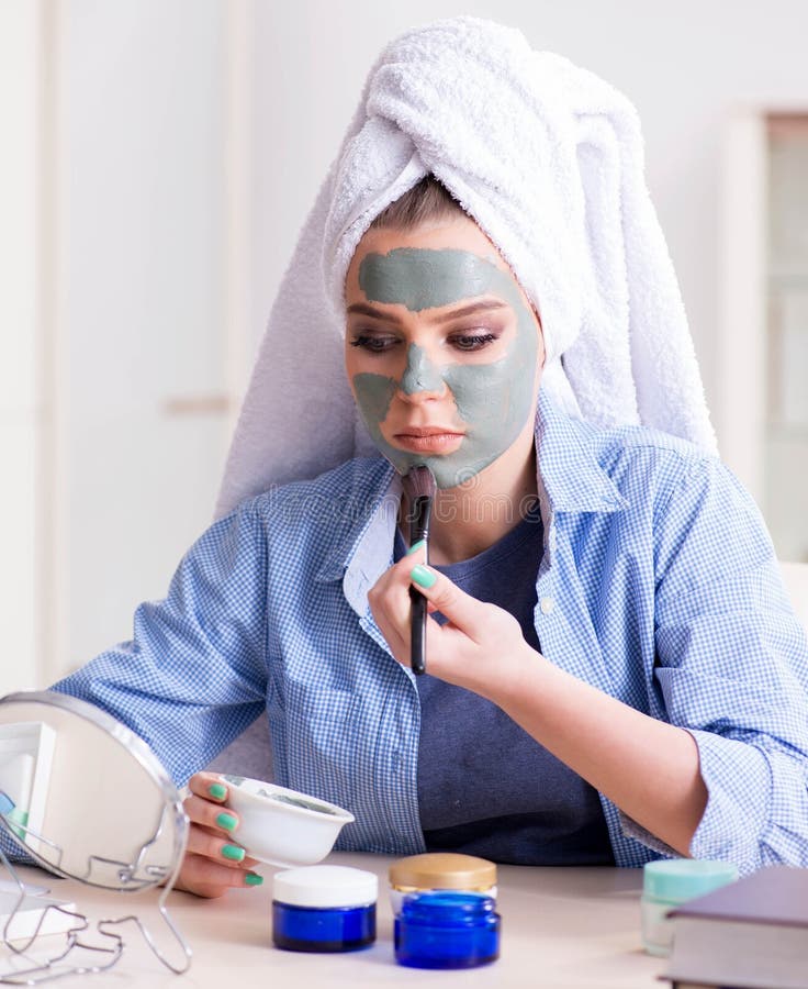 Woman Applying Clay Mask with Brush at Home Stock Photo - Image of ...