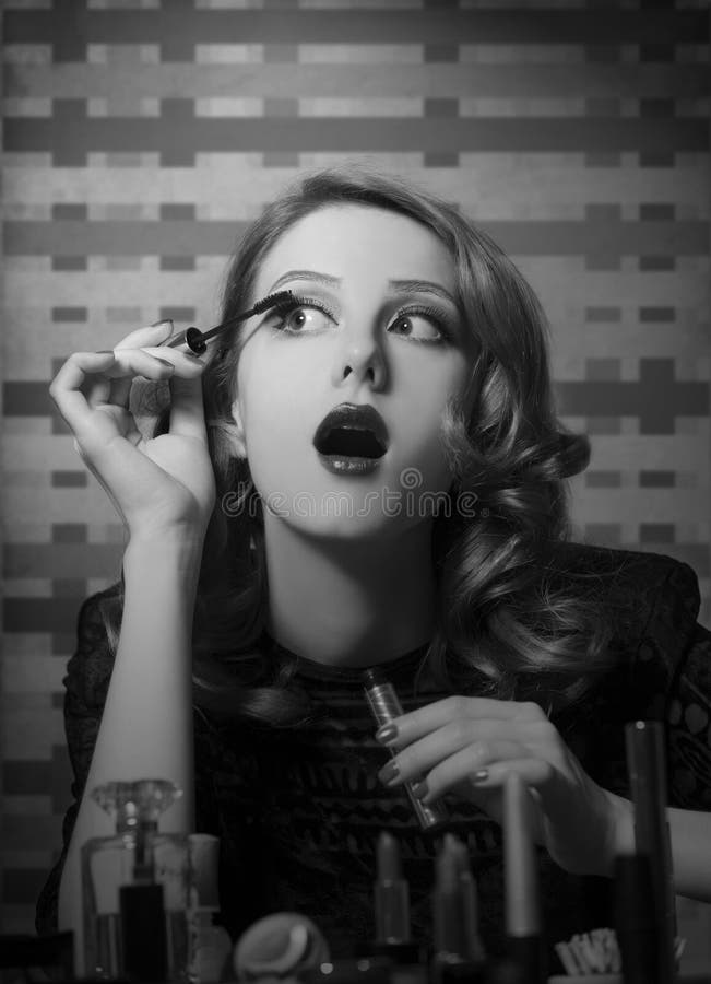 Woman applying cosmetics stock image. Image of bottle - 28759291