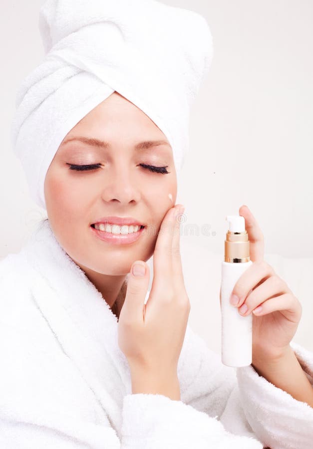 Woman applying cream stock photo. Image of body, cheerful - 23417254