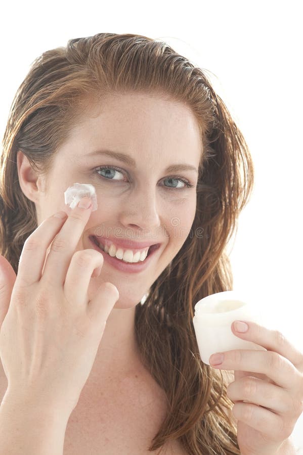 Woman Applying Cream on Face Stock Image - Image of adult, applying ...