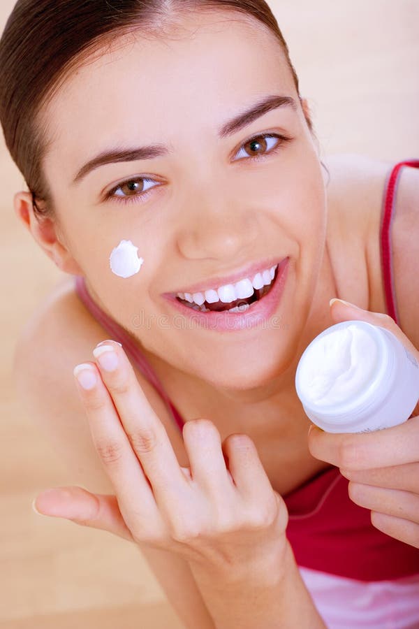 Woman Applying Cream on Her Face Stock Image - Image of mask, hand: 5883081