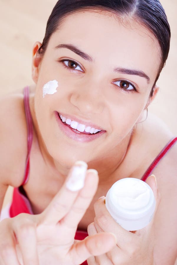 Woman Applying Cream on Her Face Stock Image - Image of mask, hand: 5883081