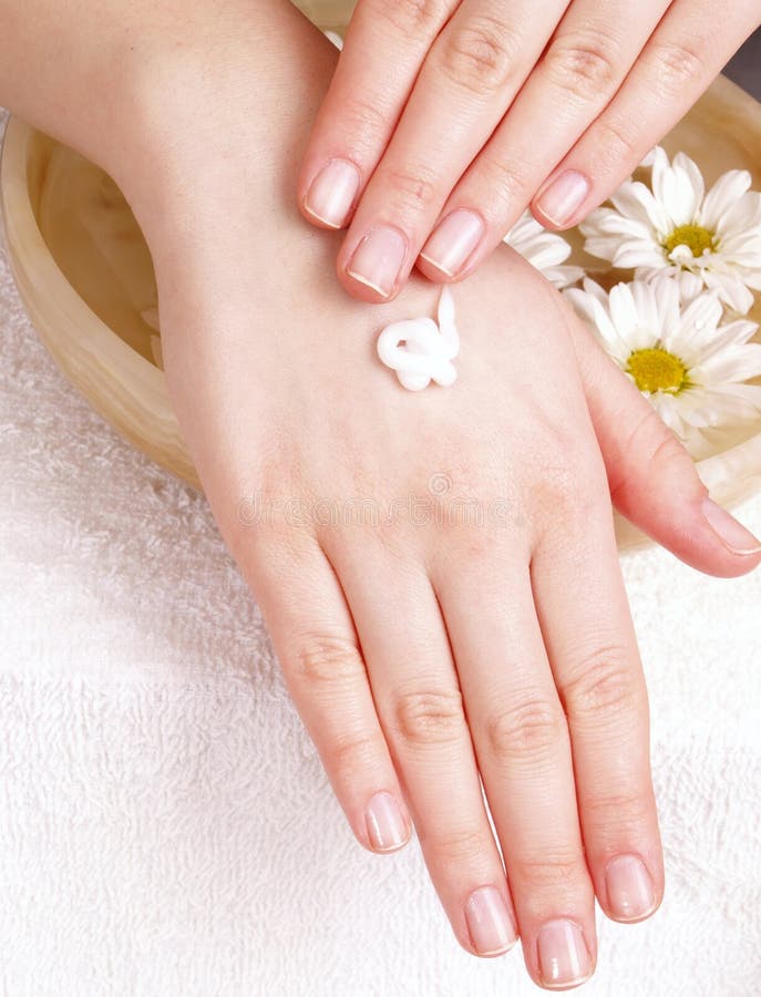 Woman Applying Cream To Her Hands Stock Image - Image of flower, woman ...