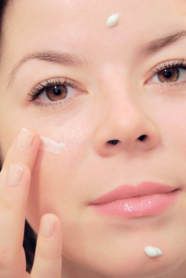 Woman applying creme stock photo. Image of face, health - 7190808