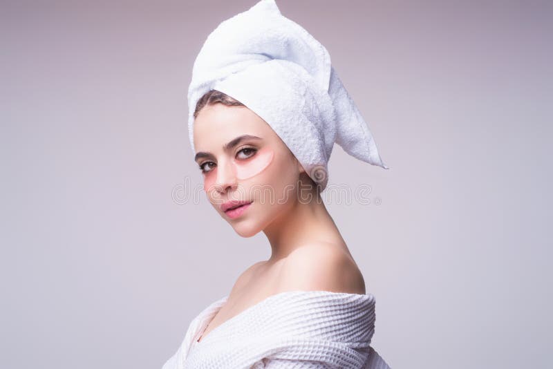 Woman Applying Eye Patches Close Up Portrait Girl With Towel On Head And Patches Under Eyes