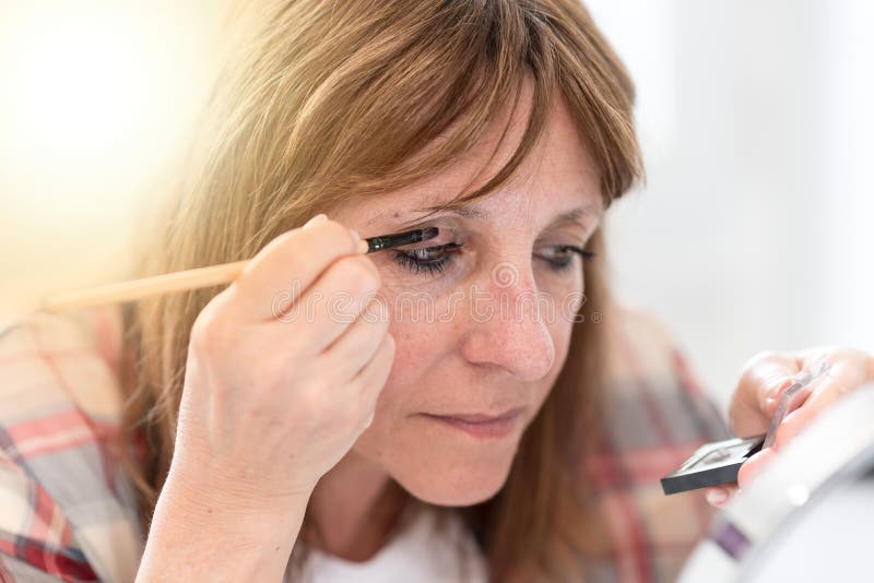 Woman Applying Eyeshadow Powder, Light Effect Stock Image - Image of ...