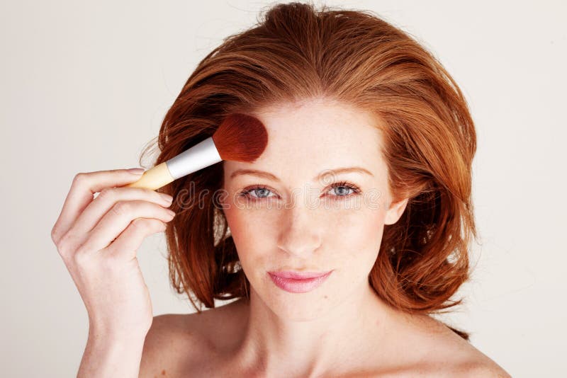 Woman Applying Face Powder stock image. Image of glamour - 23350645