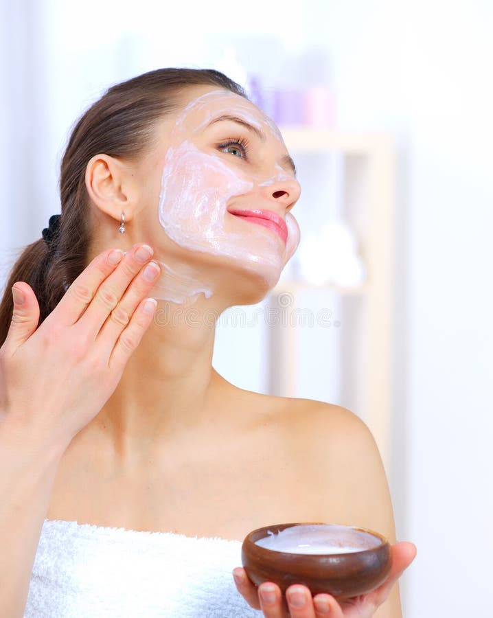 Woman Applying Facial Mask stock image. Image of natural - 23277899