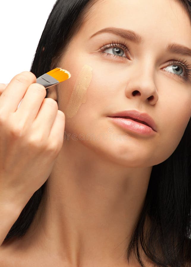Woman applying foundation stock photo. Image of natural - 21343954