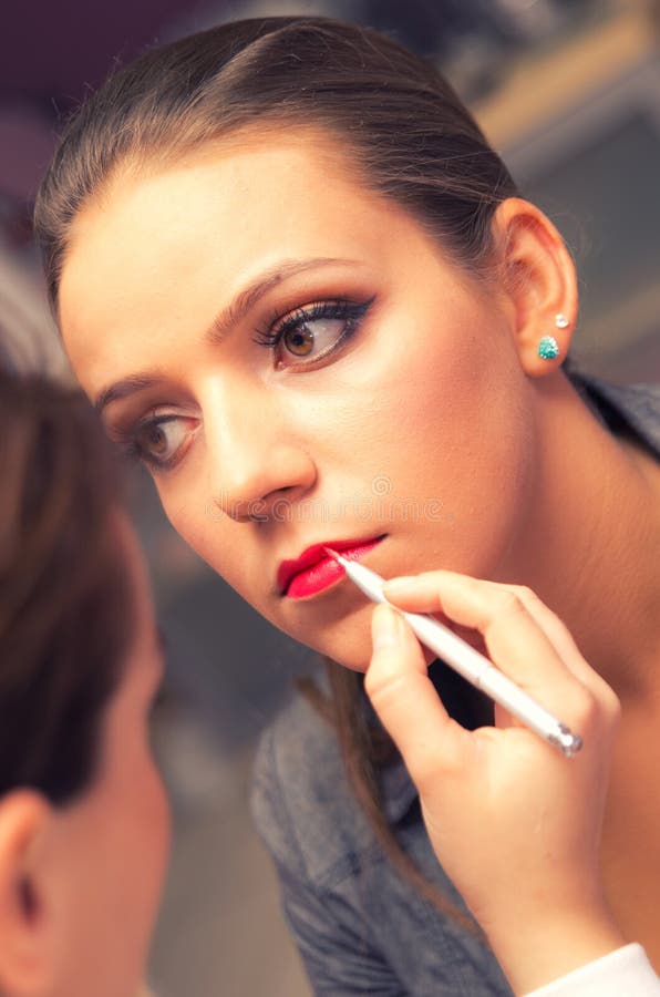 Woman applying lipstick stock image. Image of looks, makeup - 29299537