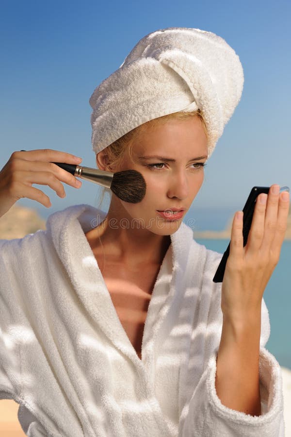 Woman applying make up stock photo. Image of gown, close - 14500450