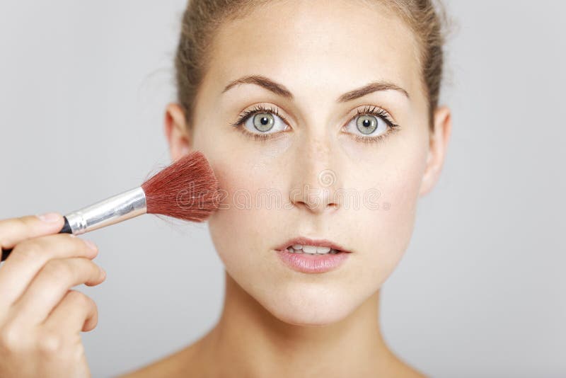 Woman applying make up stock photo. Image of cosmetic - 39398094