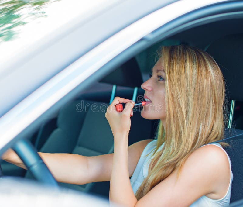 Woman Applying Make-up while Driving Car. Stock Image - Image of ...