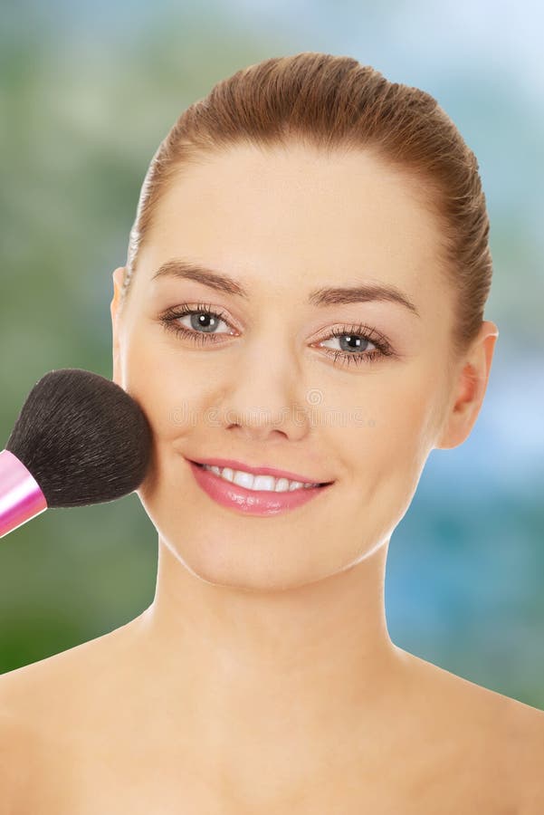 Woman applying make up. stock image. Image of blusher - 58961249