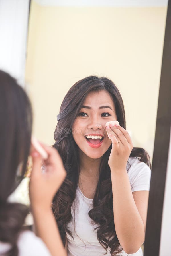Woman Applying Make Up into Her Face Stock Photo - Image of adult, long ...