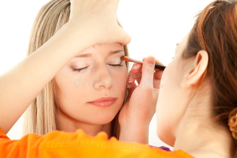 Woman applying makeup stock image. Image of girls, facial - 16585165