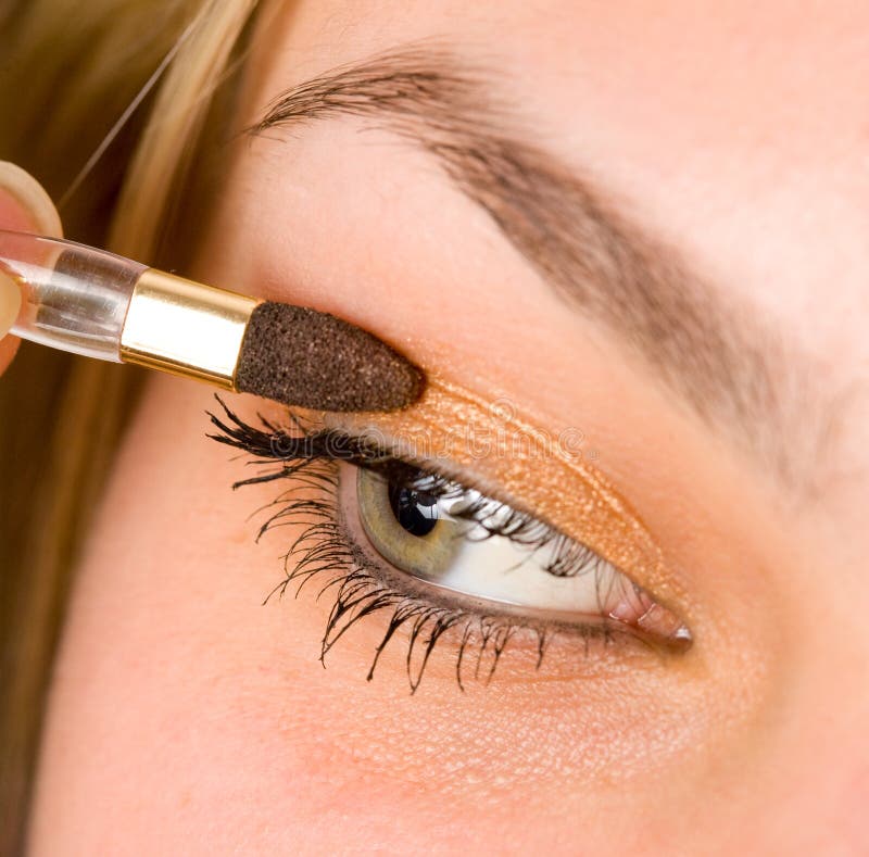 Woman applying makeup stock photo. Image of mirror, face - 8401284