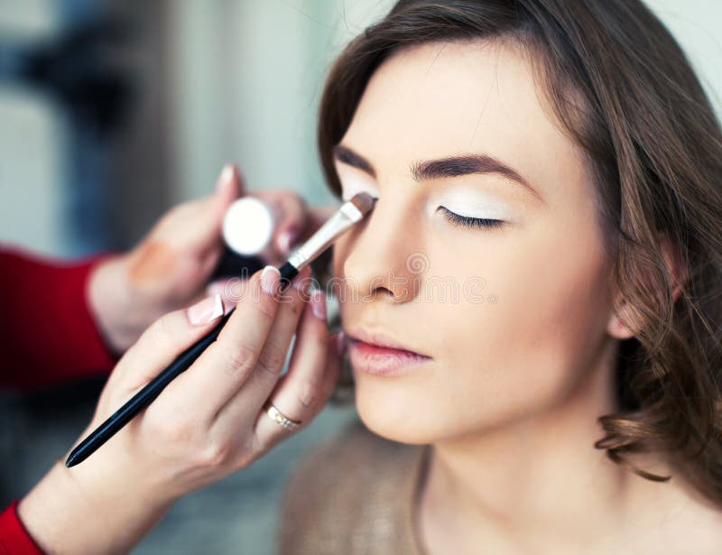 Woman applying makeup stock photo. Image of fashion, makeup - 51393896