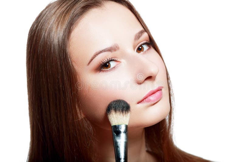 Woman applying makeup stock image. Image of portrait - 51820401