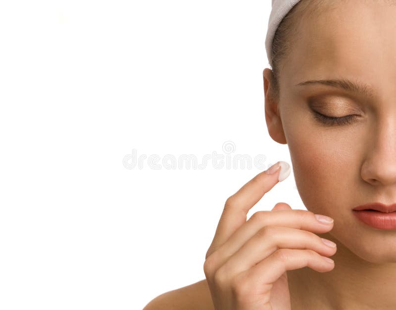 Woman applying moisturizer stock image. Image of adult - 27667477