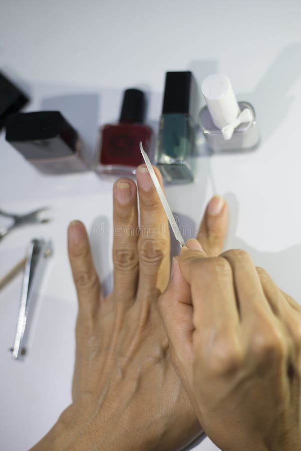 Woman Applying Nail Polish on a Hand Stock Photo - Image of design ...