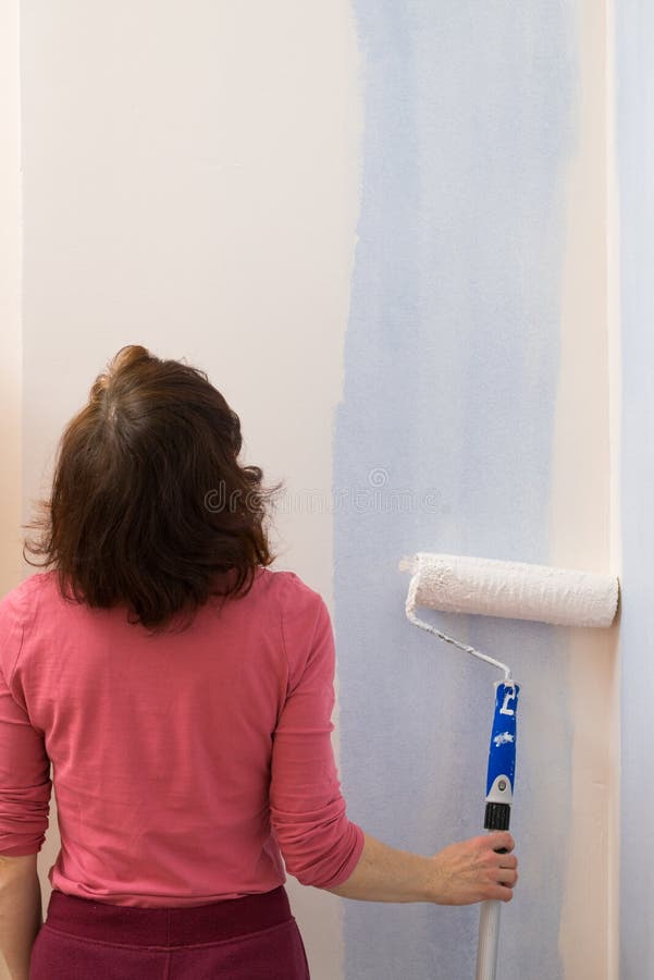 Woman Applying Paint on Wall Stock Photo - Image of professional, home ...