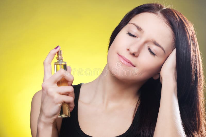 Woman applying perfume stock image. Image of eyes, beauty - 18613619