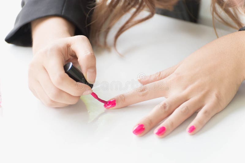 Woman Applying Pink Nail Polish on Hand Stock Image - Image of concept ...